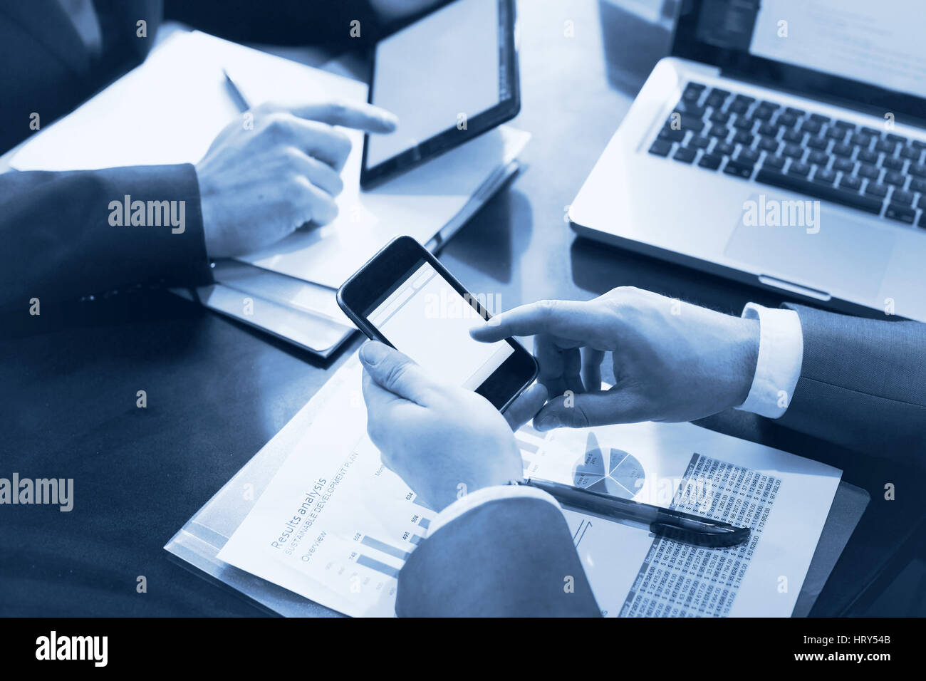 Group hands office table tablet phone hi-res stock photography and ...