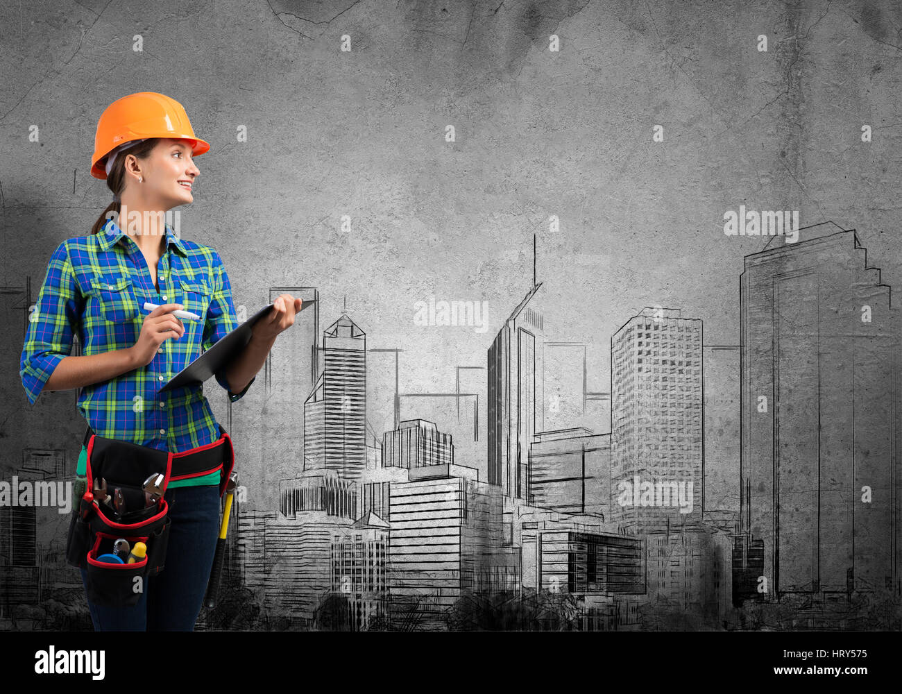 Engineer woman with folder and sketches of construction project on wall ...
