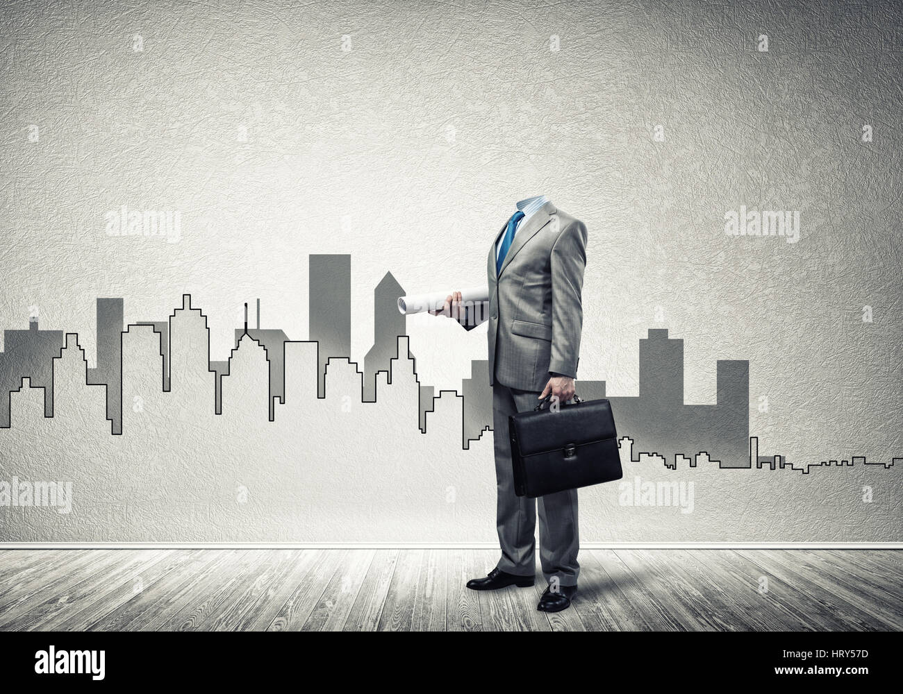 Headless engineer man with papers and case in hand against construction ...