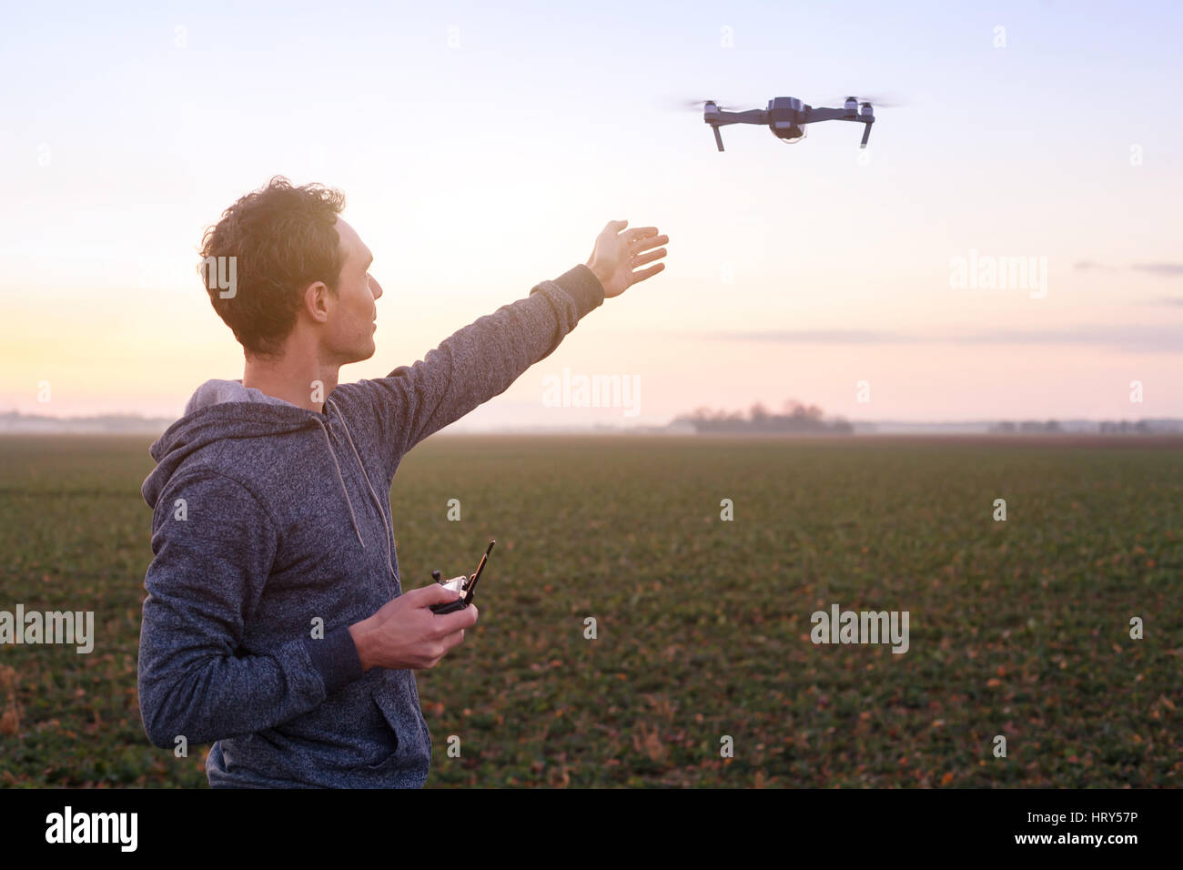 man piloting drone, humans and technology communication Stock Photo - Alamy