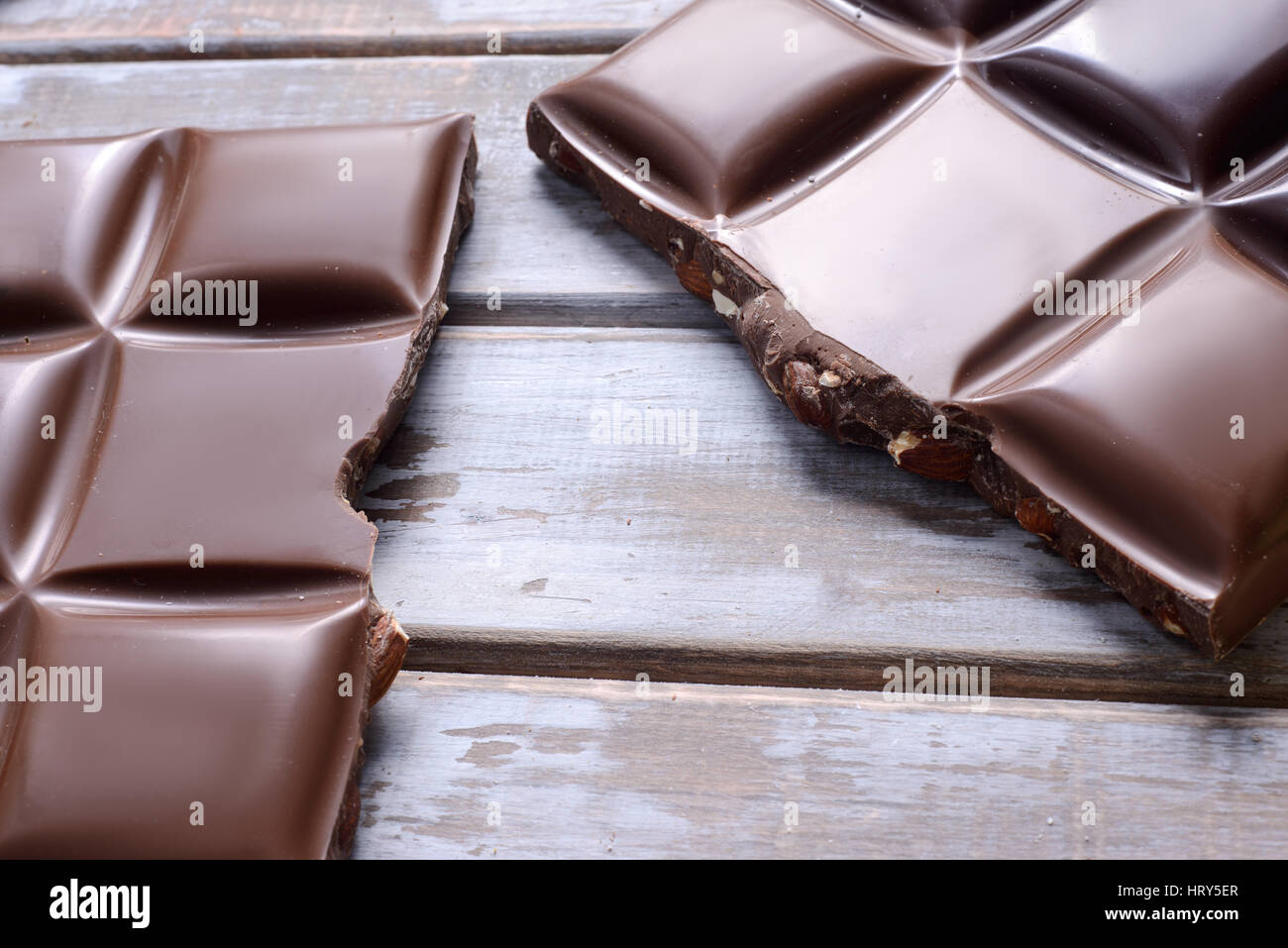chocolate bar on wooden background Stock Photo - Alamy