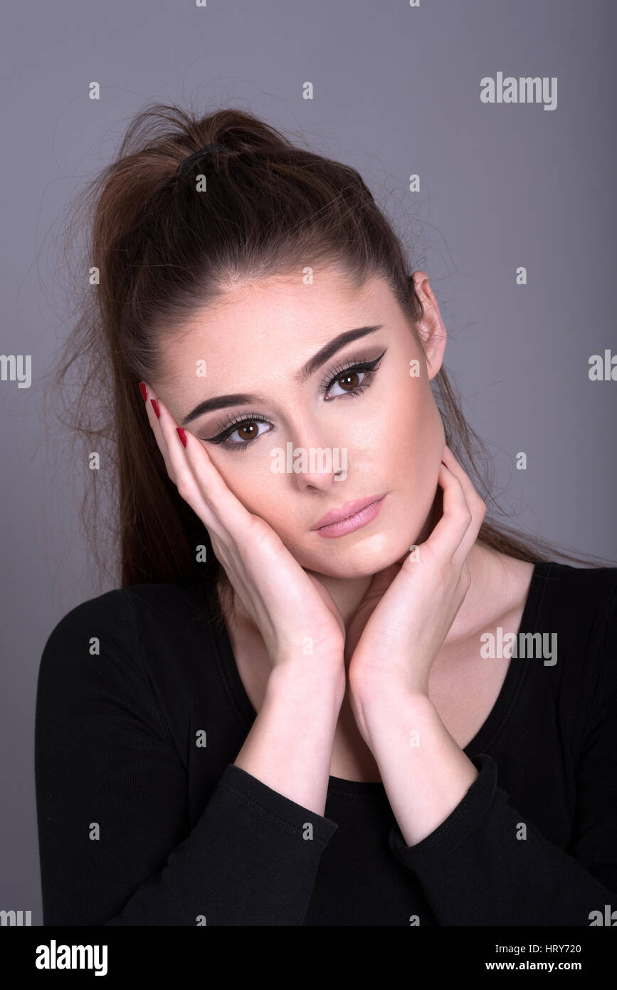 Face leaning on hands hi-res stock photography and images - Alamy