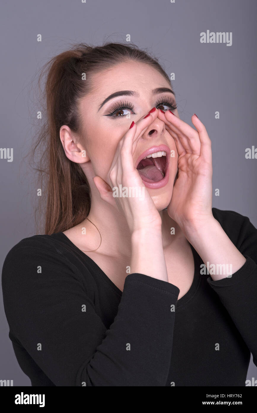 Hands cupped around mouth hi-res stock photography and images - Alamy