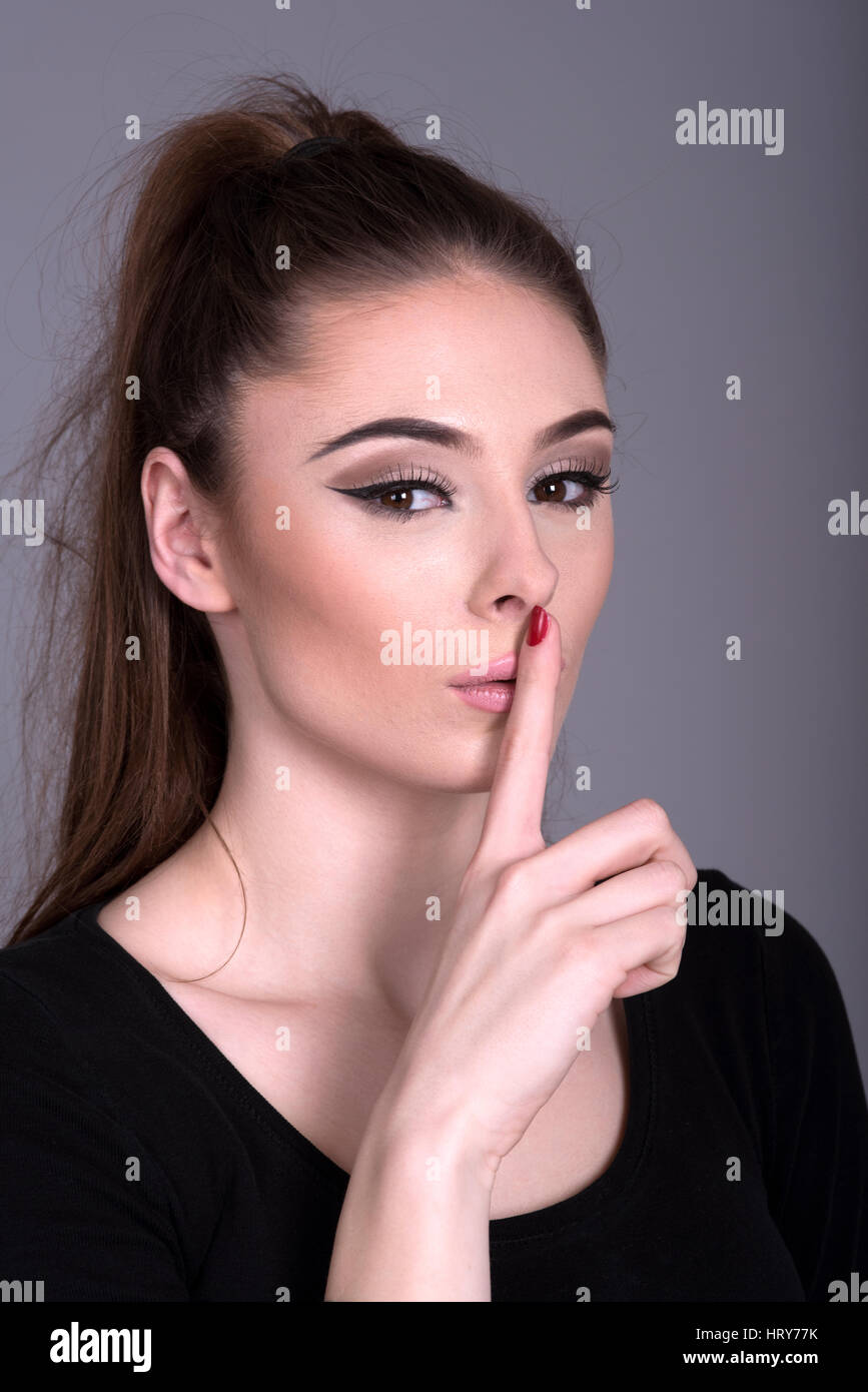 Fingers to lips hi-res stock photography and images - Alamy