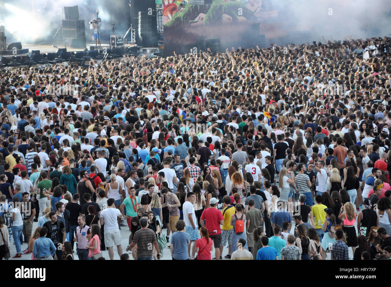 CLUJ NAPOCA, ROMANIA – JULY 30, 2015: Crowd of cheerful young people ...