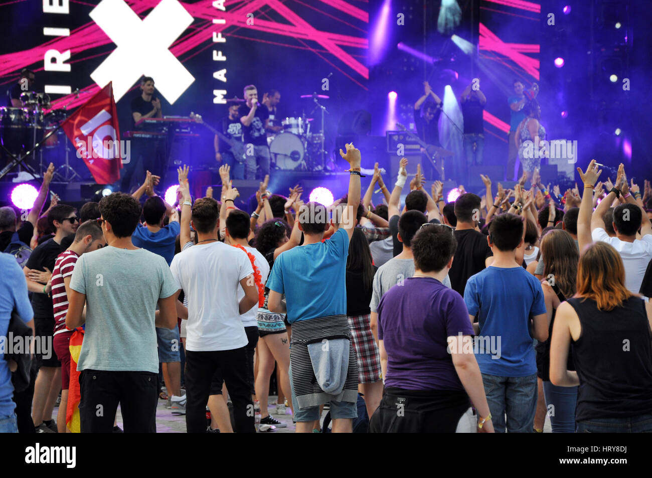 CLUJ NAPOCA, ROMANIA – AUGUST 2, 2015: Crowd of partying people enjoy a ...