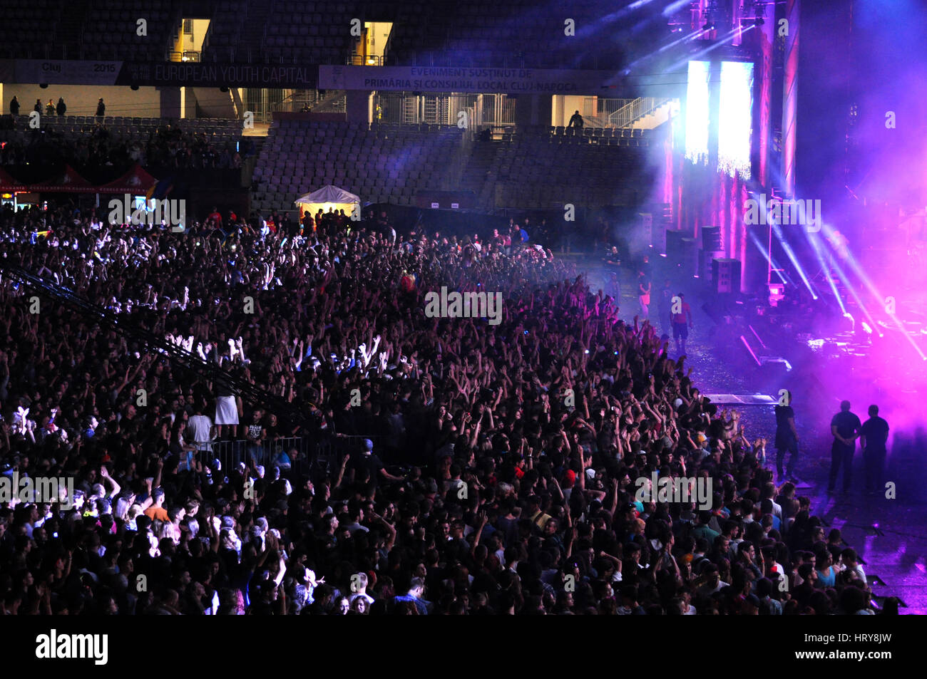 CLUJ NAPOCA, ROMANIA – JULY 31, 2015: Crowd of cheerful young people ...