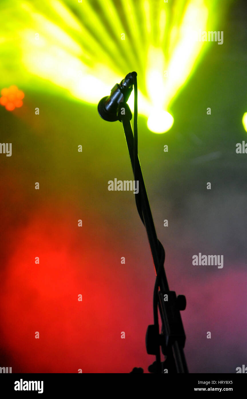 Microphone in stage lights Stock Photo - Alamy