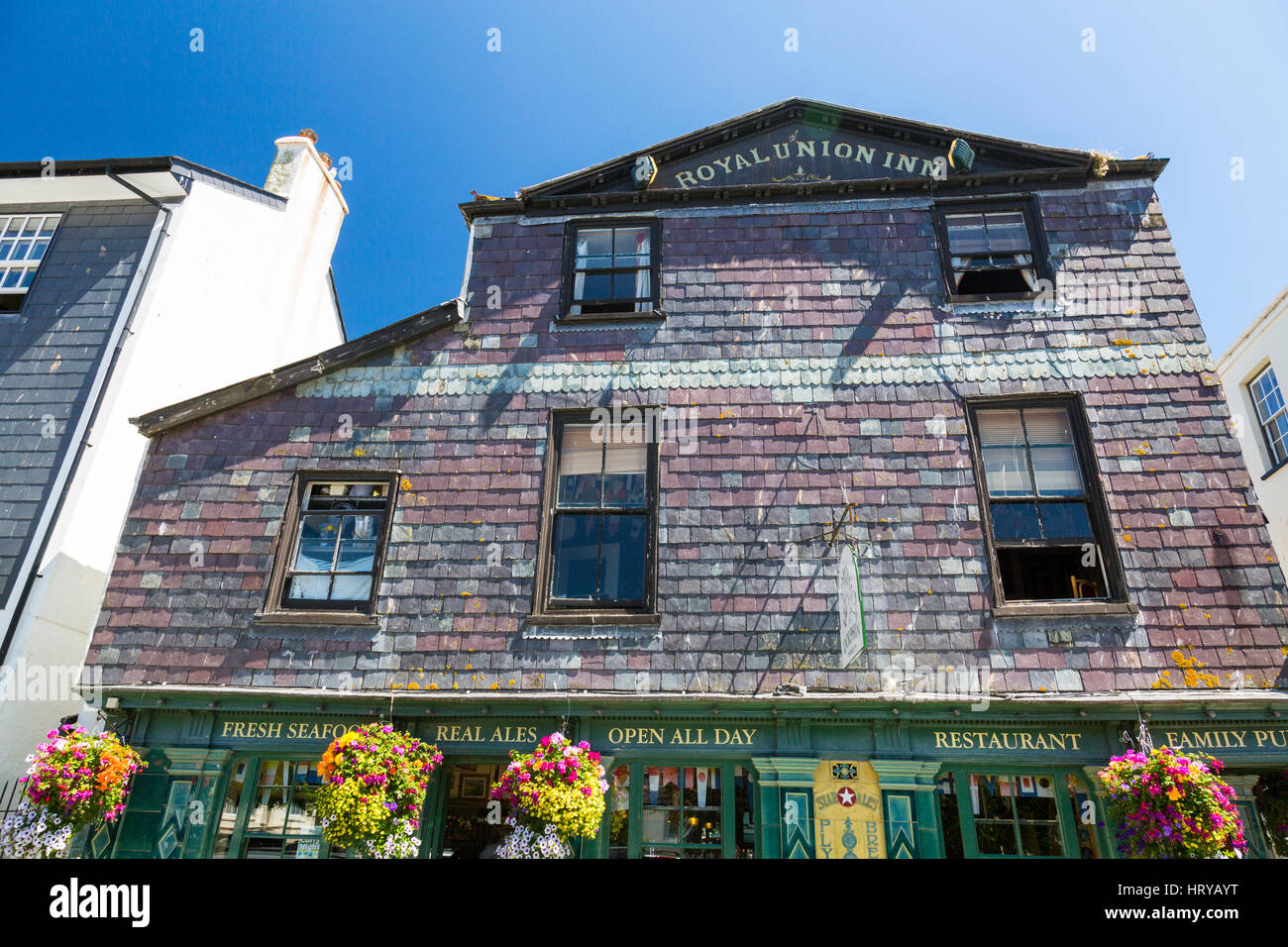 Hanging baskets adorn the slate-fronted Dolphin pub - originally called ...