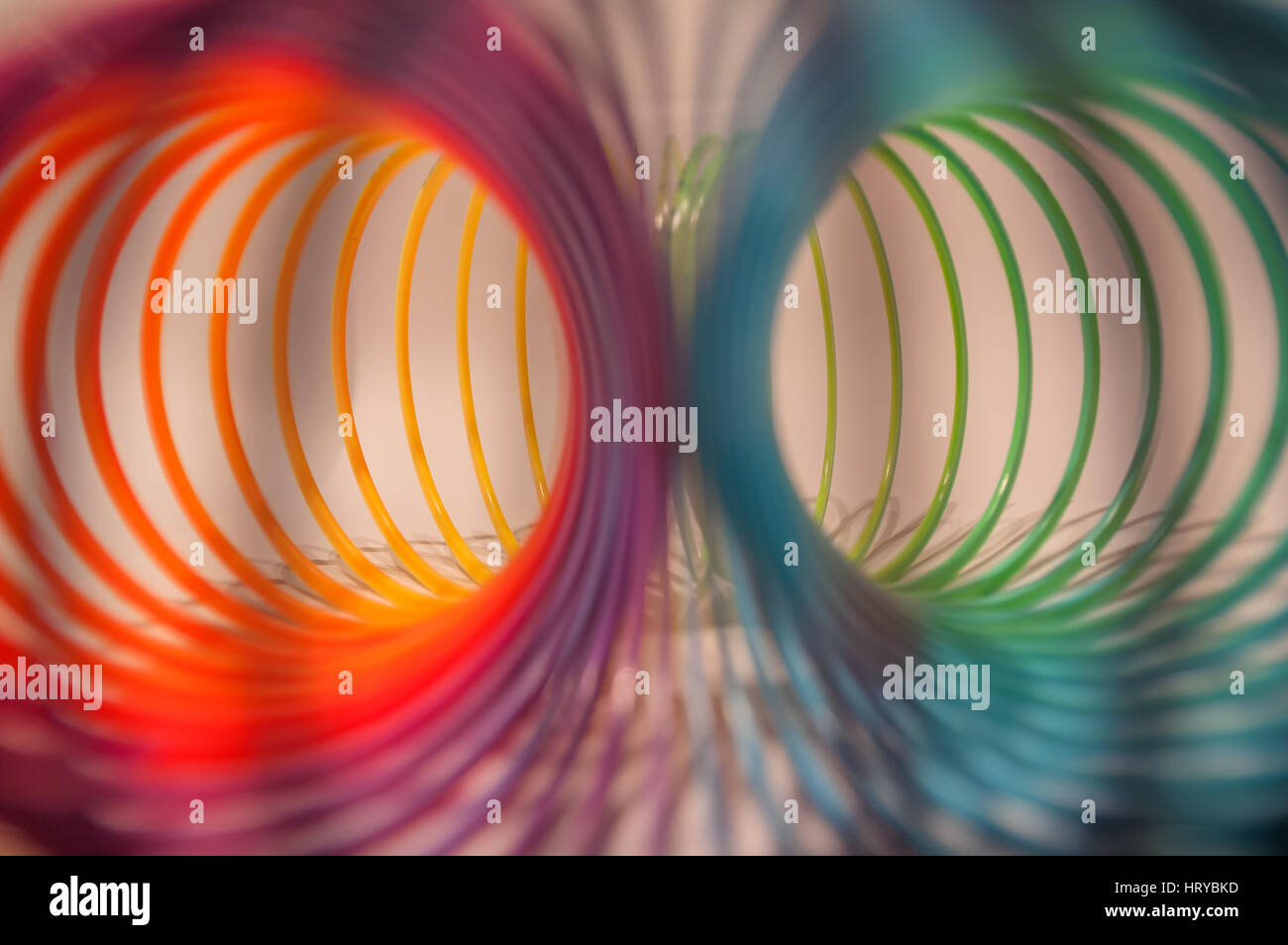 close-up of colorful slinky Stock Photo - Alamy
