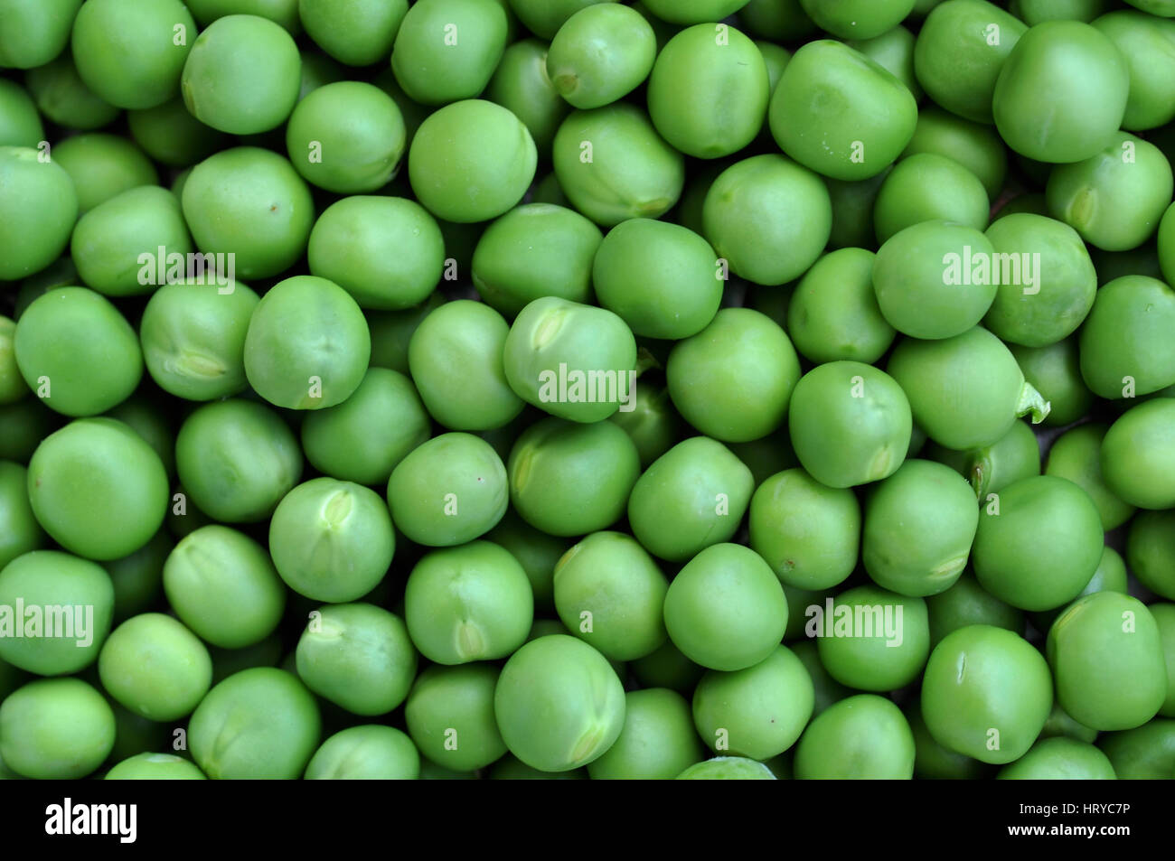 Fresh green peas background texture Stock Photo - Alamy
