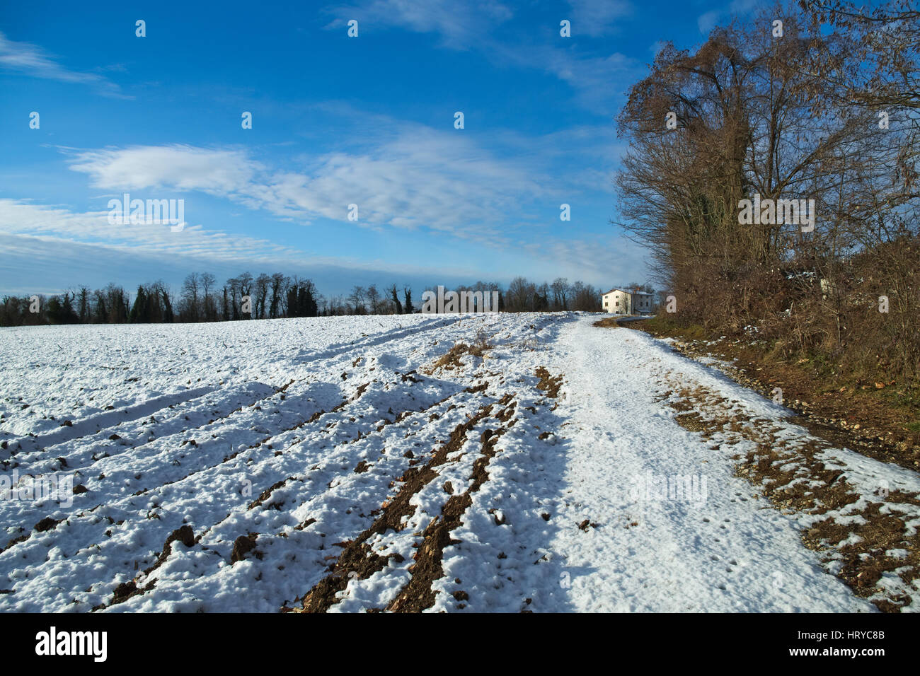View of the countryside with a bit of snow in the winter season and a ...