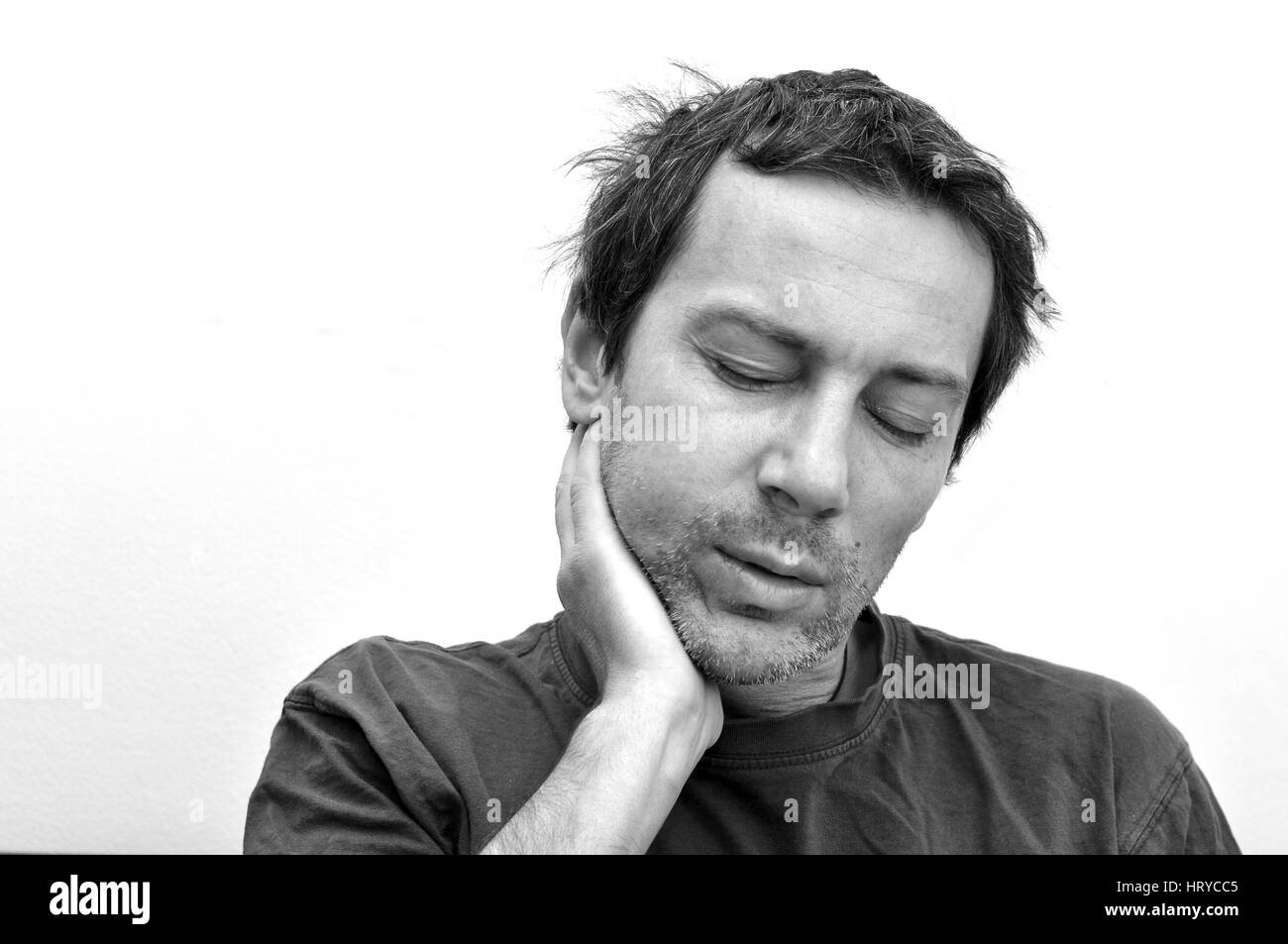 Young man suffering from toothache, teeth pain, swollen face Stock ...