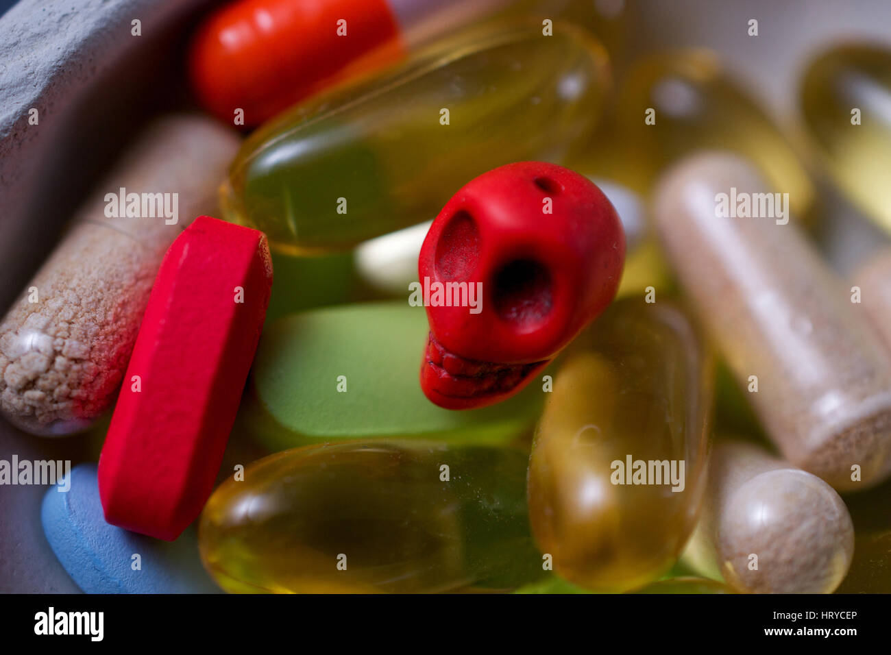 Closeup on prescription pills, dietary supplements and a pill-sized ...