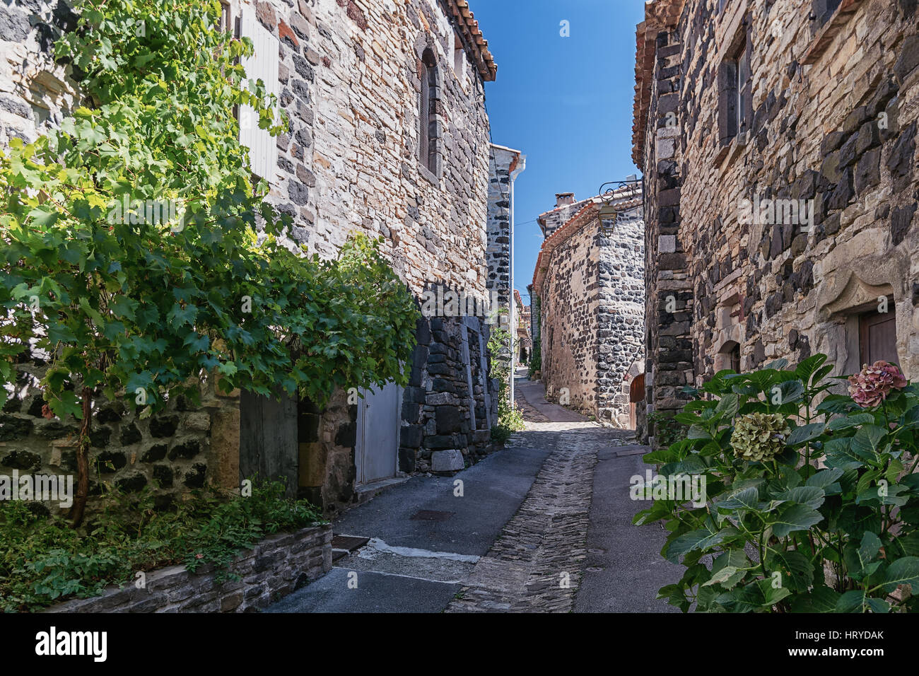 The narrow street in the picturesque village of Mirabel Ardèche, France ...
