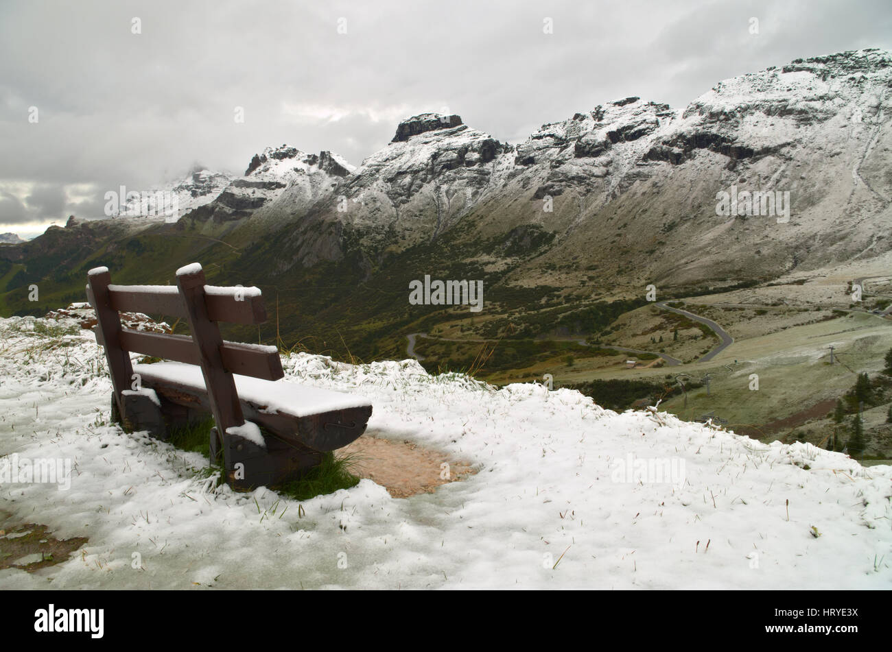 Passo Pordoi: bench covered by the first snow of the season on the ...
