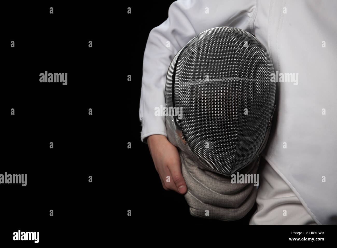 Fencer woman hold the helmet in her hand and wearing white fencing ...