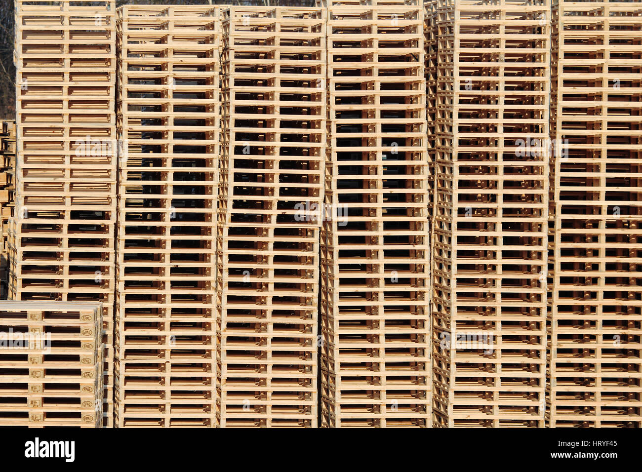 wooden pallets on stock in factory backyard Stock Photo - Alamy