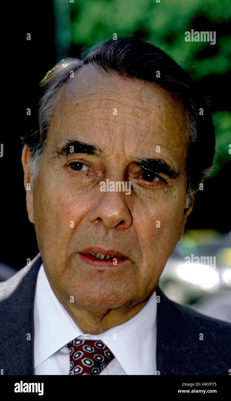 Senator Robert Dole Republican from Kansas talks with reporters outside ...