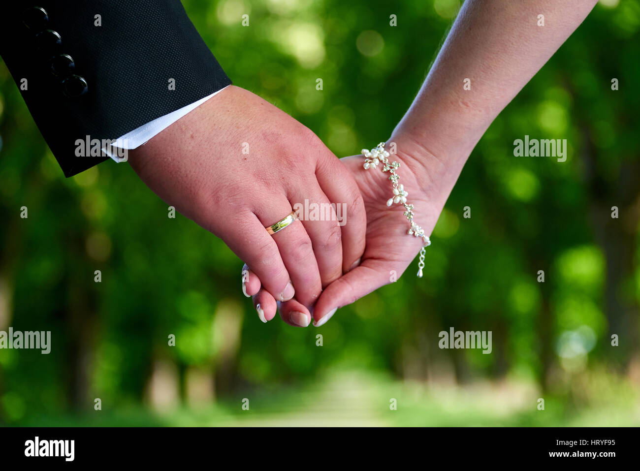 wedding couple hand in hand Stock Photo - Alamy