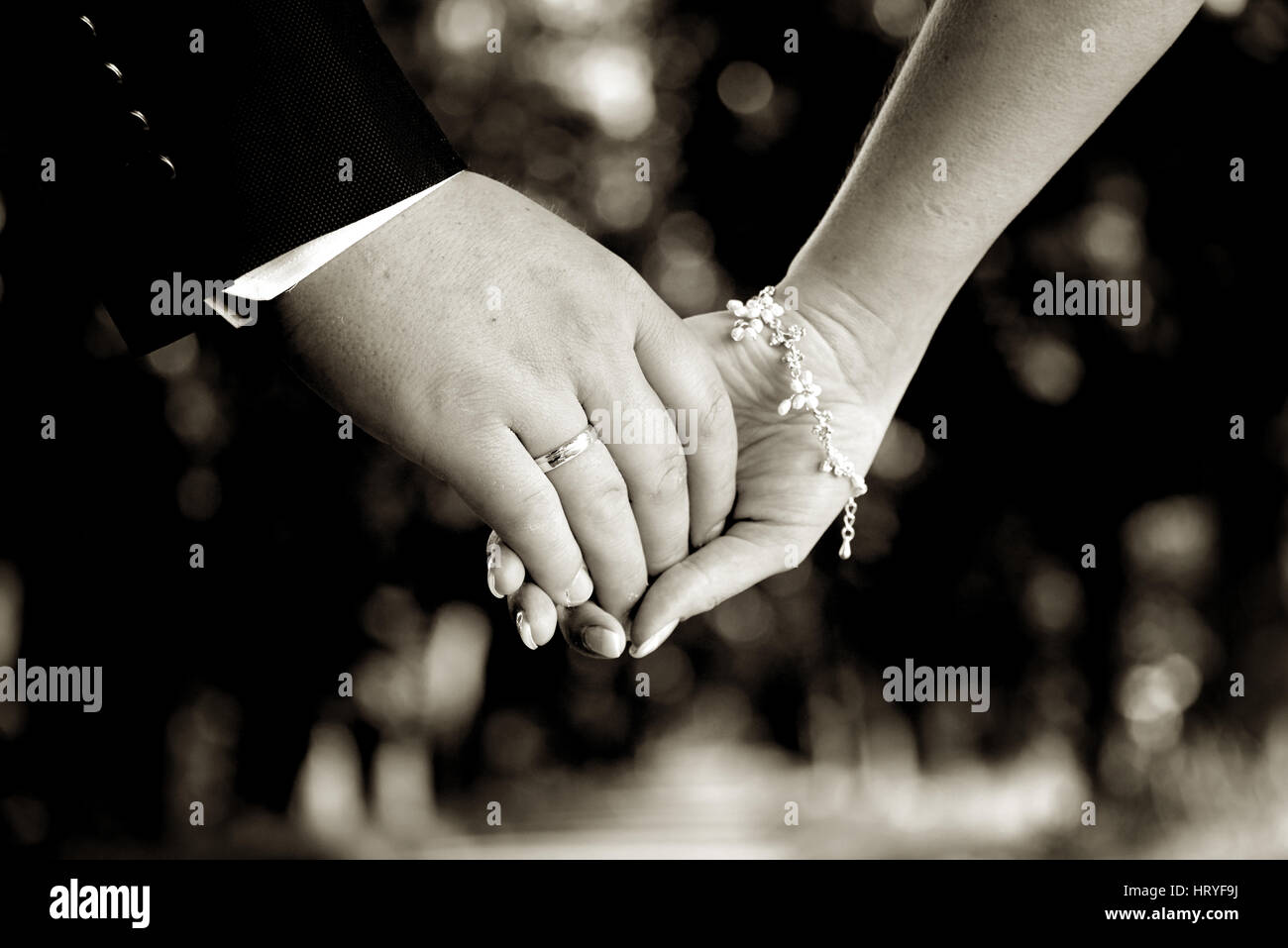 wedding couple hand in hand Stock Photo - Alamy