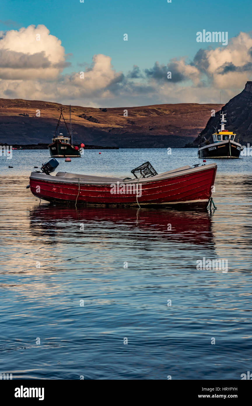 Small dinghy with outboard motor anchored in Portree Harbour, Isle of ...