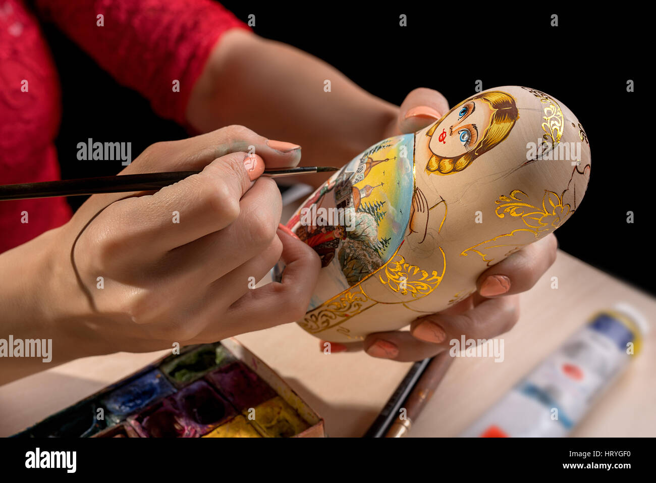 Master decorating matrioshka close up shot Stock Photo - Alamy