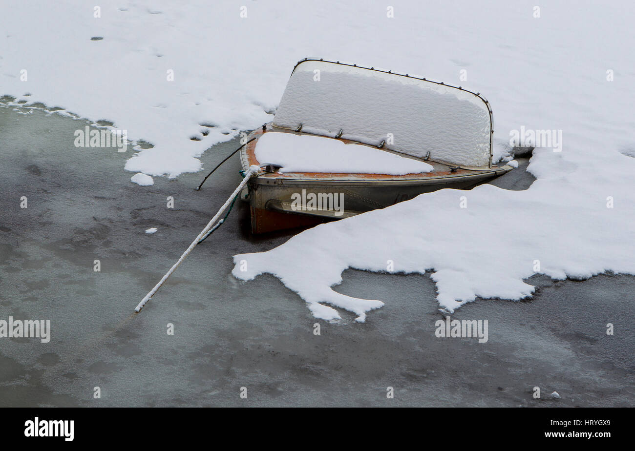An image of an old boat sunken into the ice of Hauser Lake, Idaho in ...