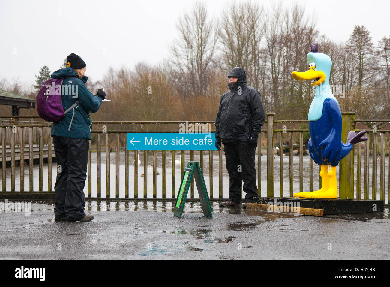 Person ducks in wind hi-res stock photography and images - Alamy