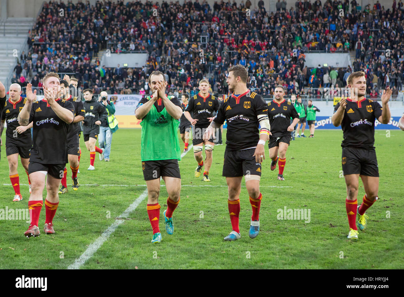 Germany's team celebrates after the 3rd Rugby Europe Championship match ...