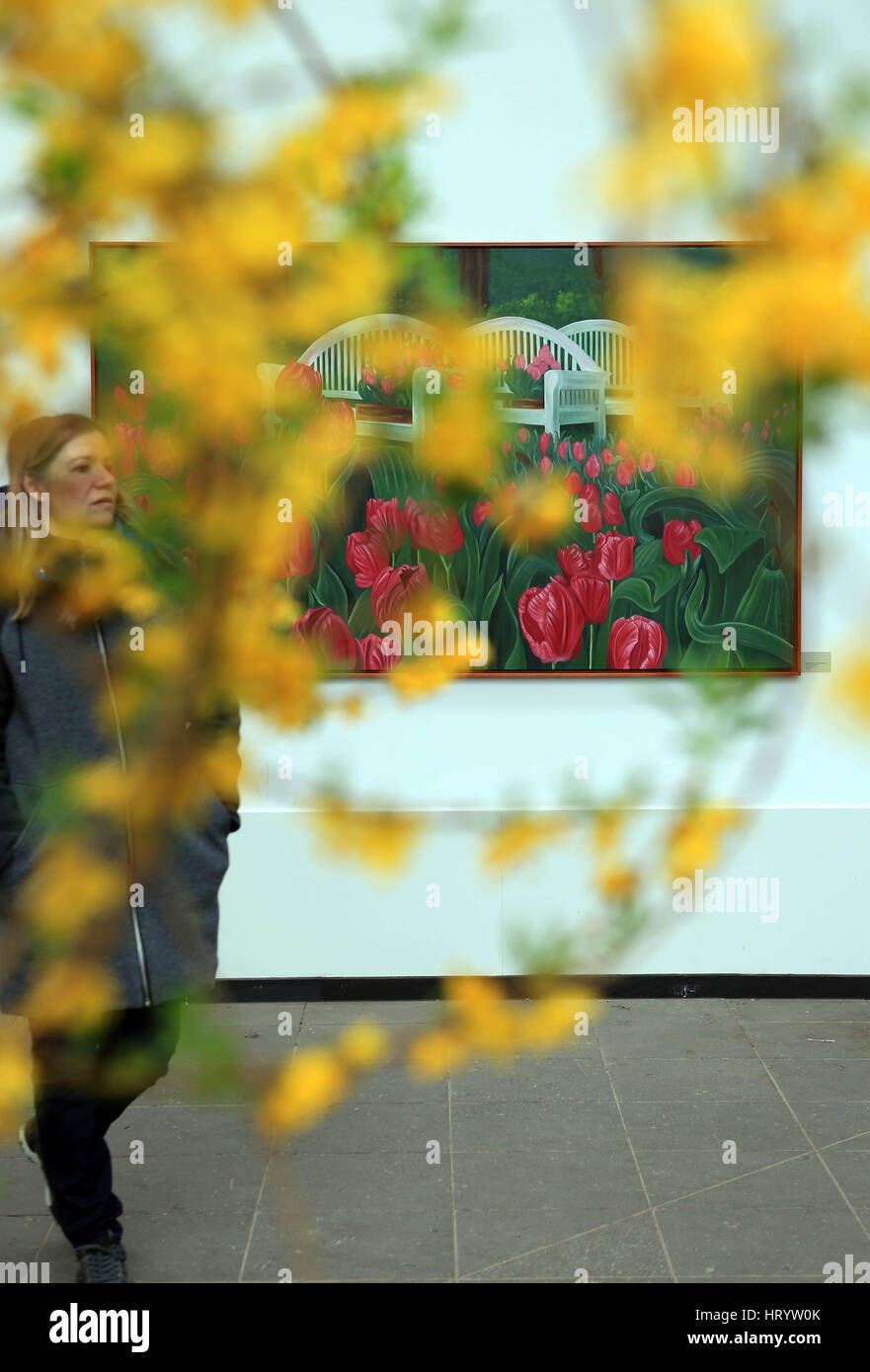 Frankfurt, Germany. 5th Mar, 2017. A woman visits the flower exhibition ...