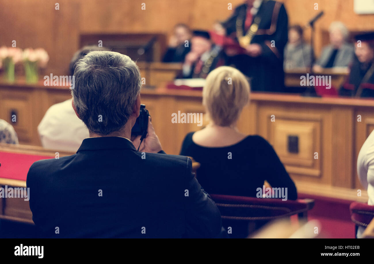 Audience at a official ceremony Stock Photo - Alamy