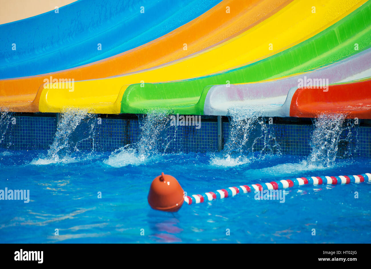 Colorful plastic water-slides in aqua park Stock Photo - Alamy