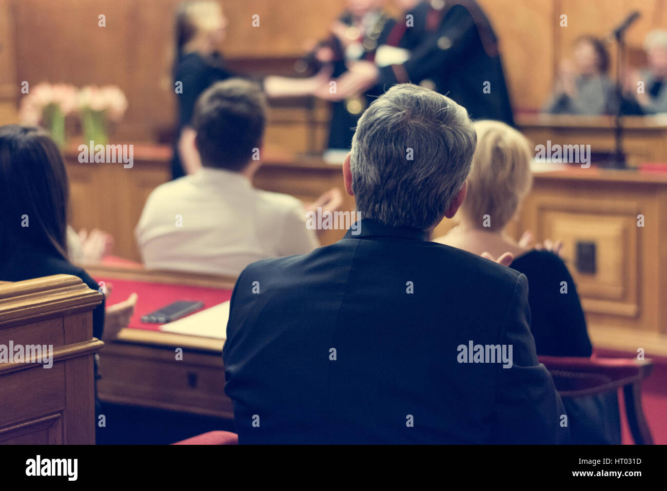 Audience at a official ceremony Stock Photo - Alamy