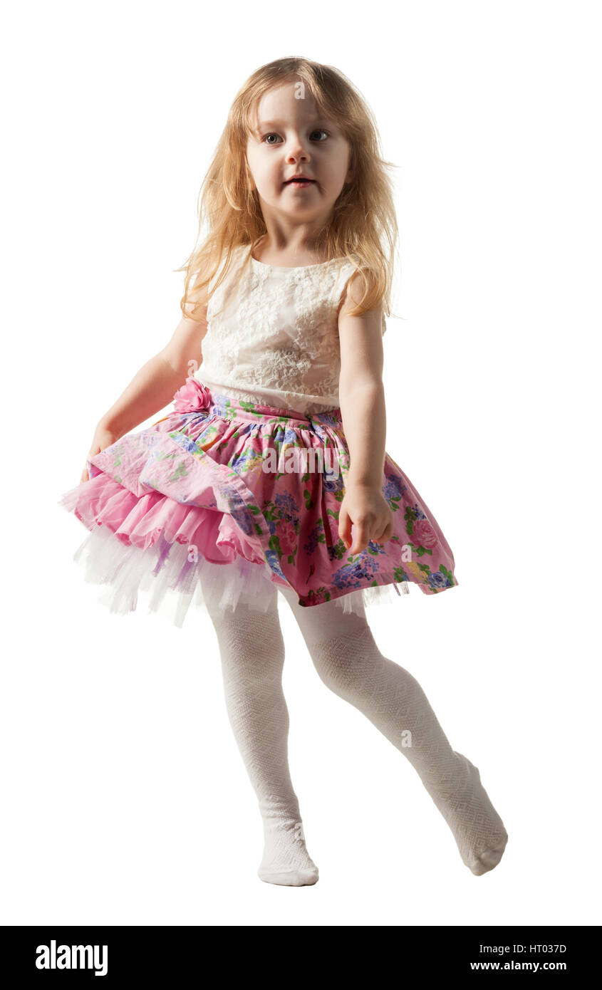 Cute three-year girl is jumping, running, dancing, laughing. Her hair ...