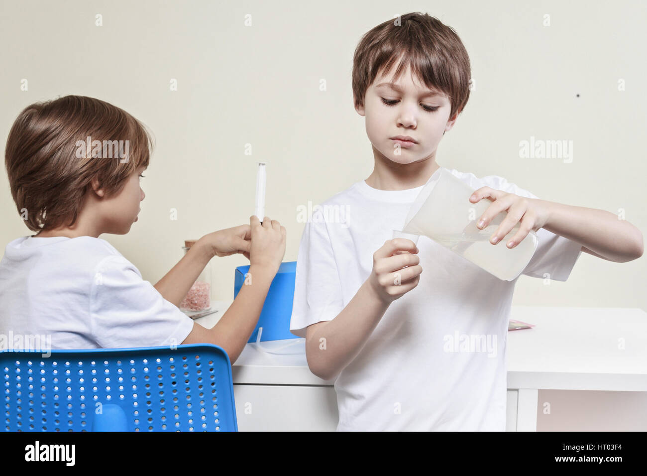Boys making science experiments. Education concept Stock Photo - Alamy