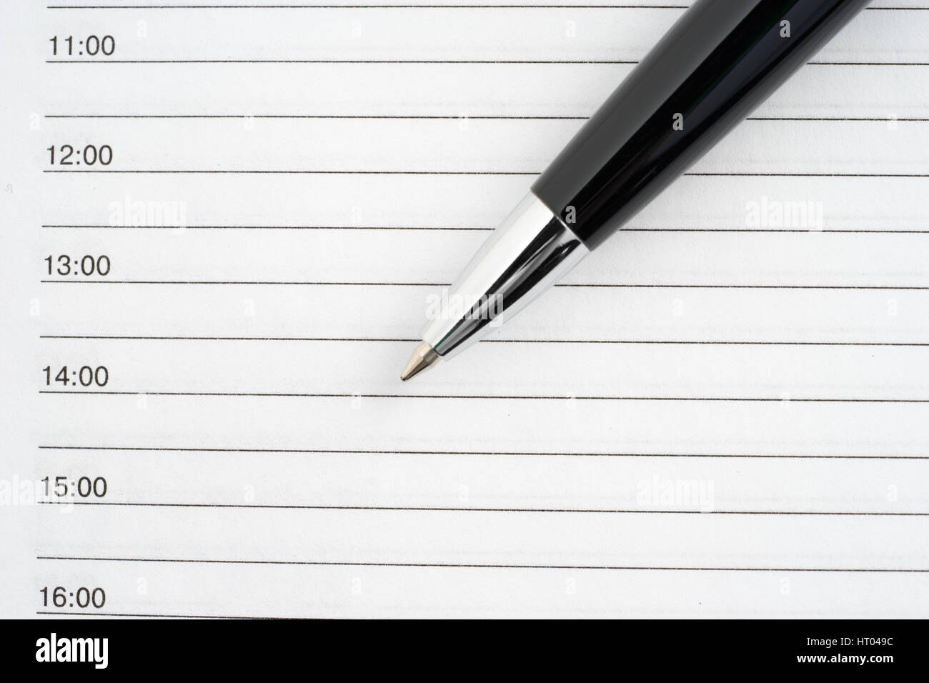 Daily planner with a pen, close-up Stock Photo - Alamy
