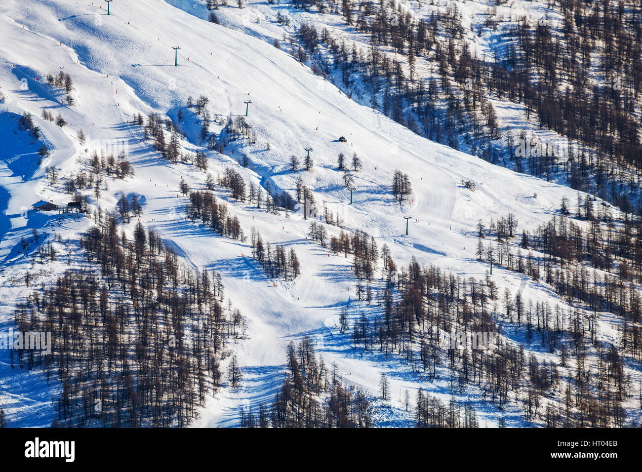 Top view picture of snowy mountains with steep slopes at alpine ski ...