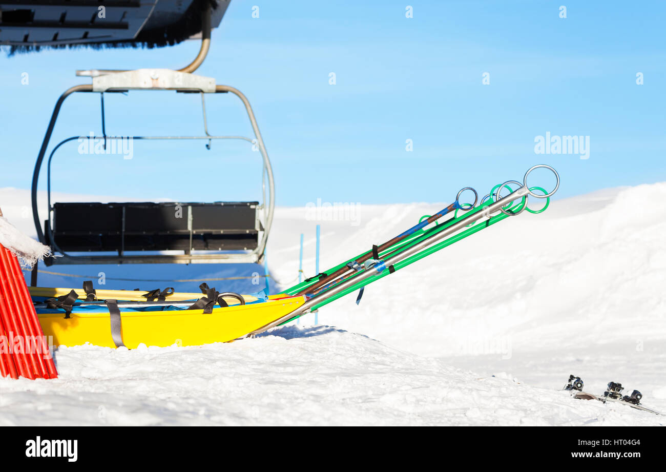Empty rescue sleds standing next to chairlift at ski resort Stock Photo ...