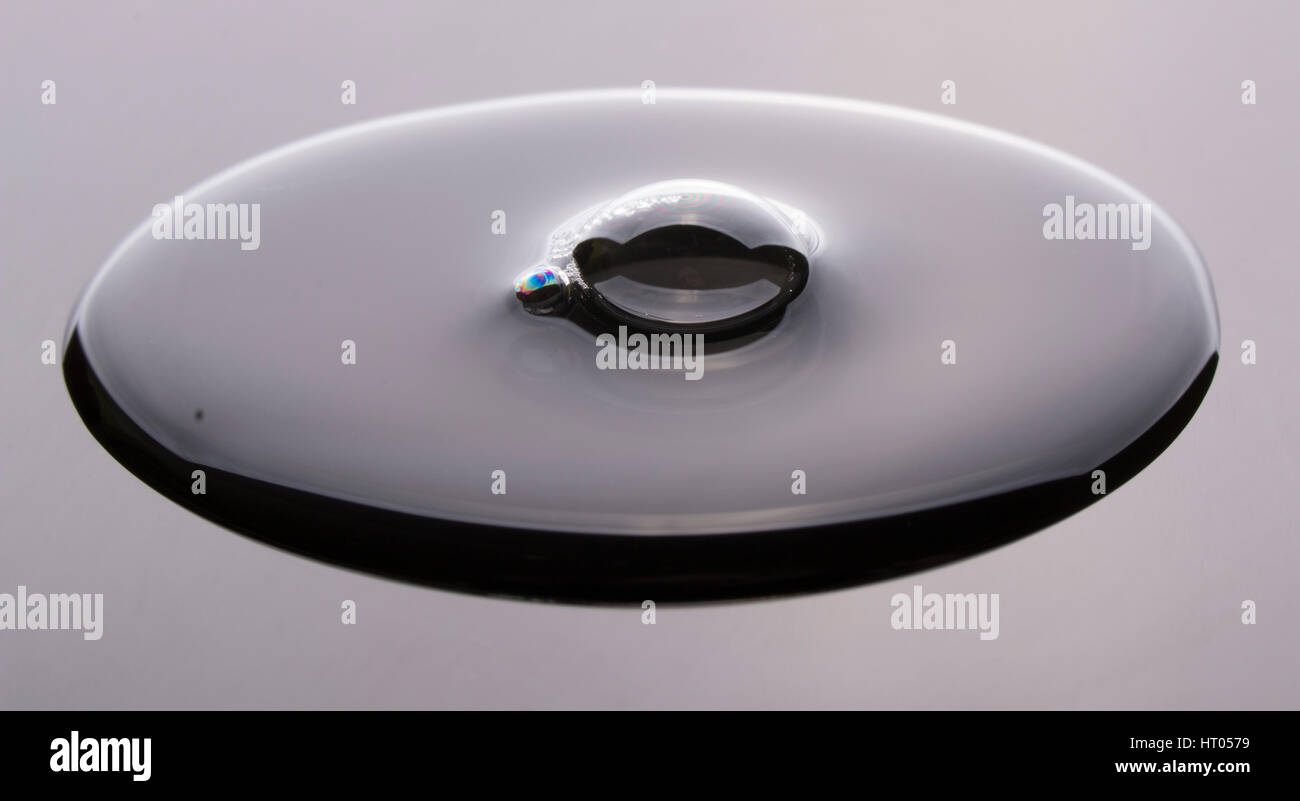 Water drop on grey surface Stock Photo - Alamy