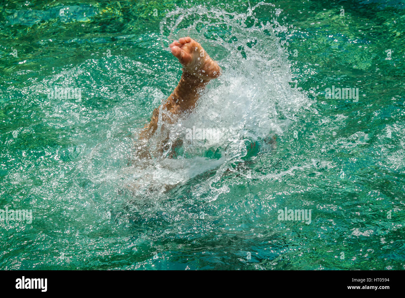 dive in to sea,leg still on the surface Stock Photo - Alamy