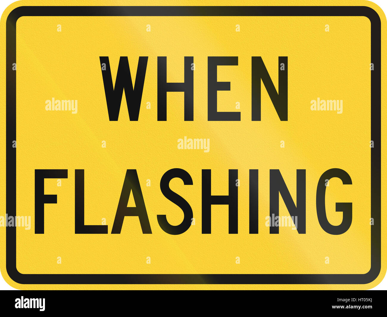 United States MUTCD road sign - When flashing Stock Photo - Alamy