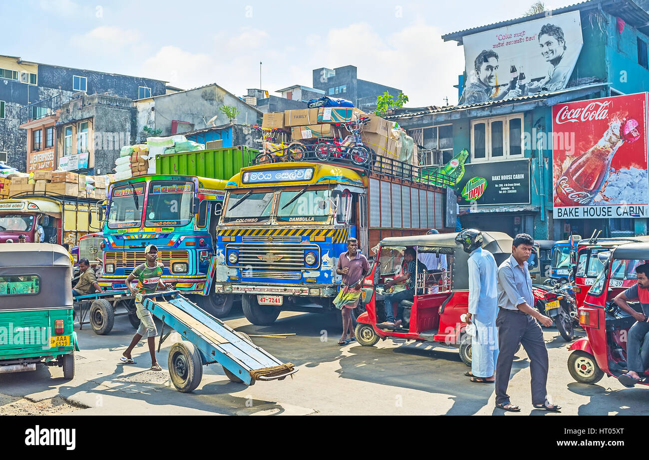 COLOMBO, SRI LANKA - DECEMBER 6, 2016: The colorful trucks, loaded with ...