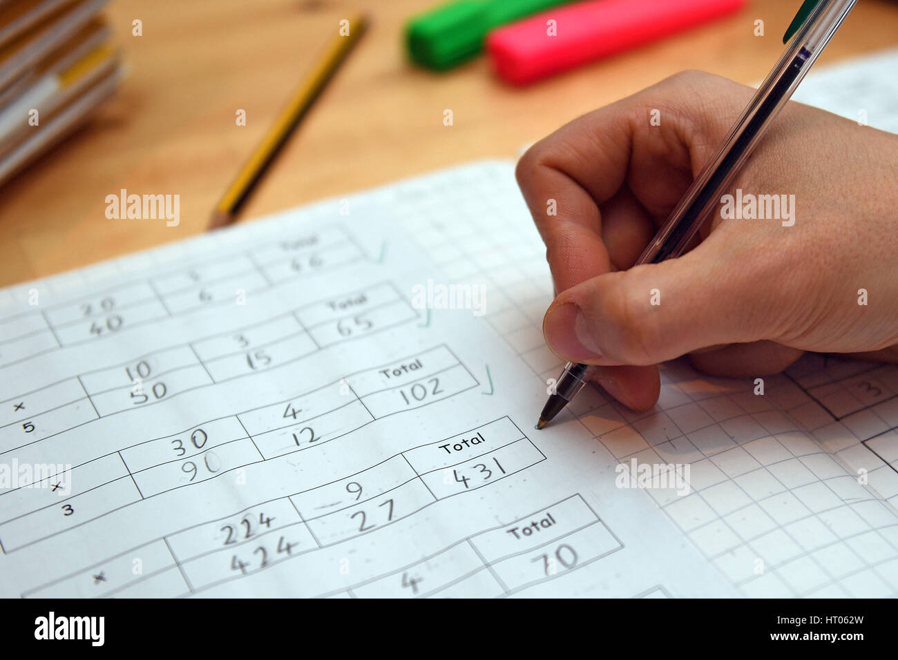 A primary school teacher marking a pupil's maths homework Stock Photo ...