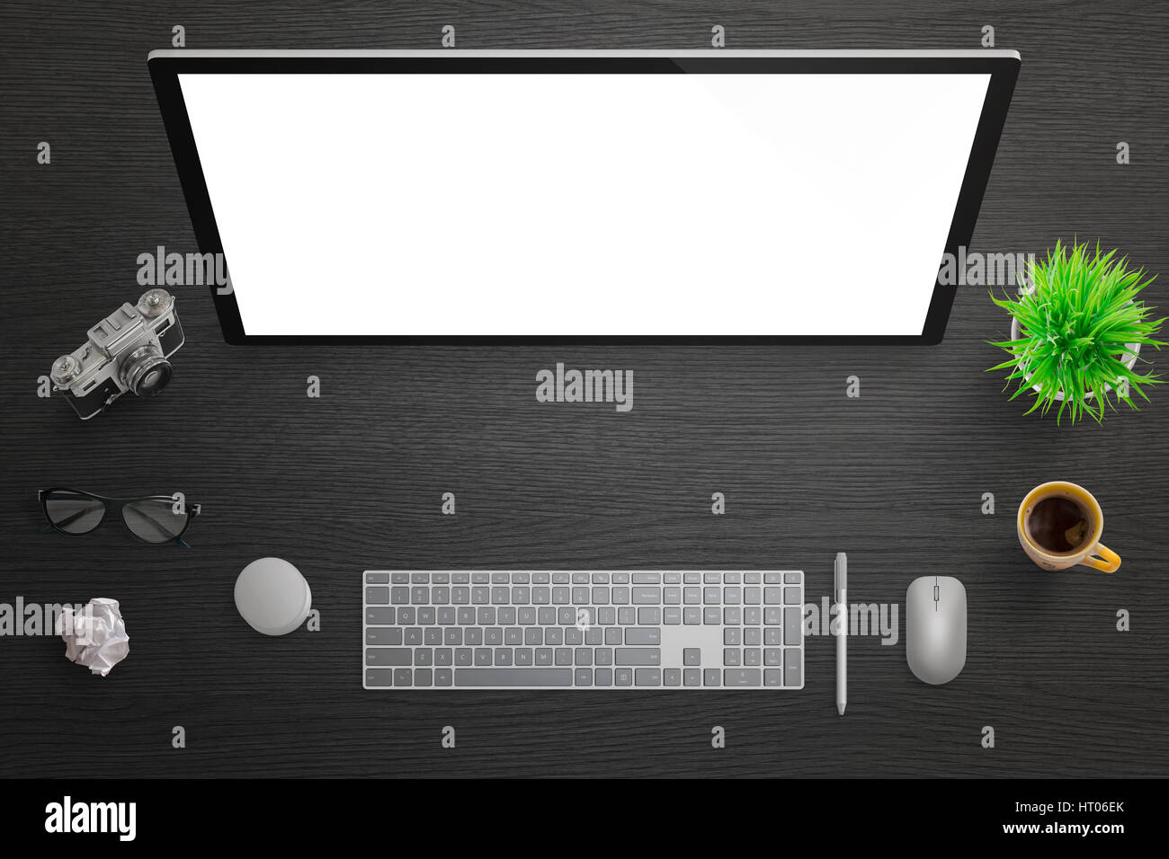 Isolated computer touch screen for mockup. Top view of black desk with ...