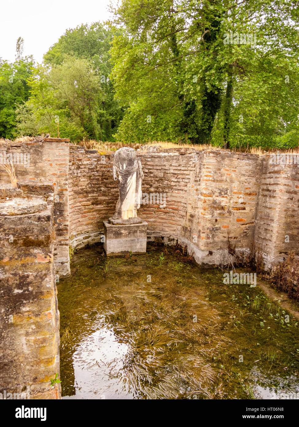 Ancient ruins and woman statue in the Dion Archeological Site in Greece ...