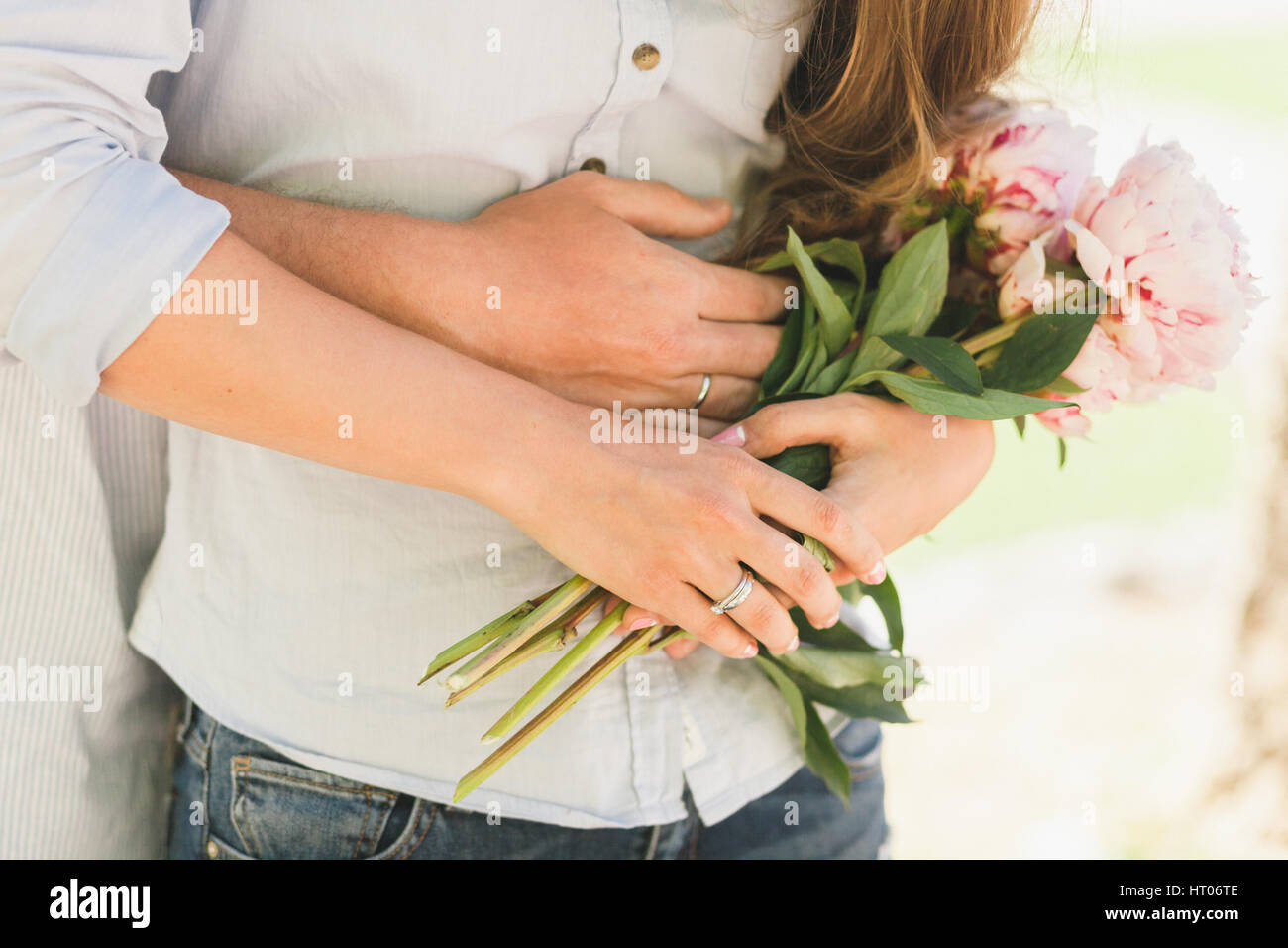 engaged couple hug together. Close up shot of hands Stock Photo - Alamy