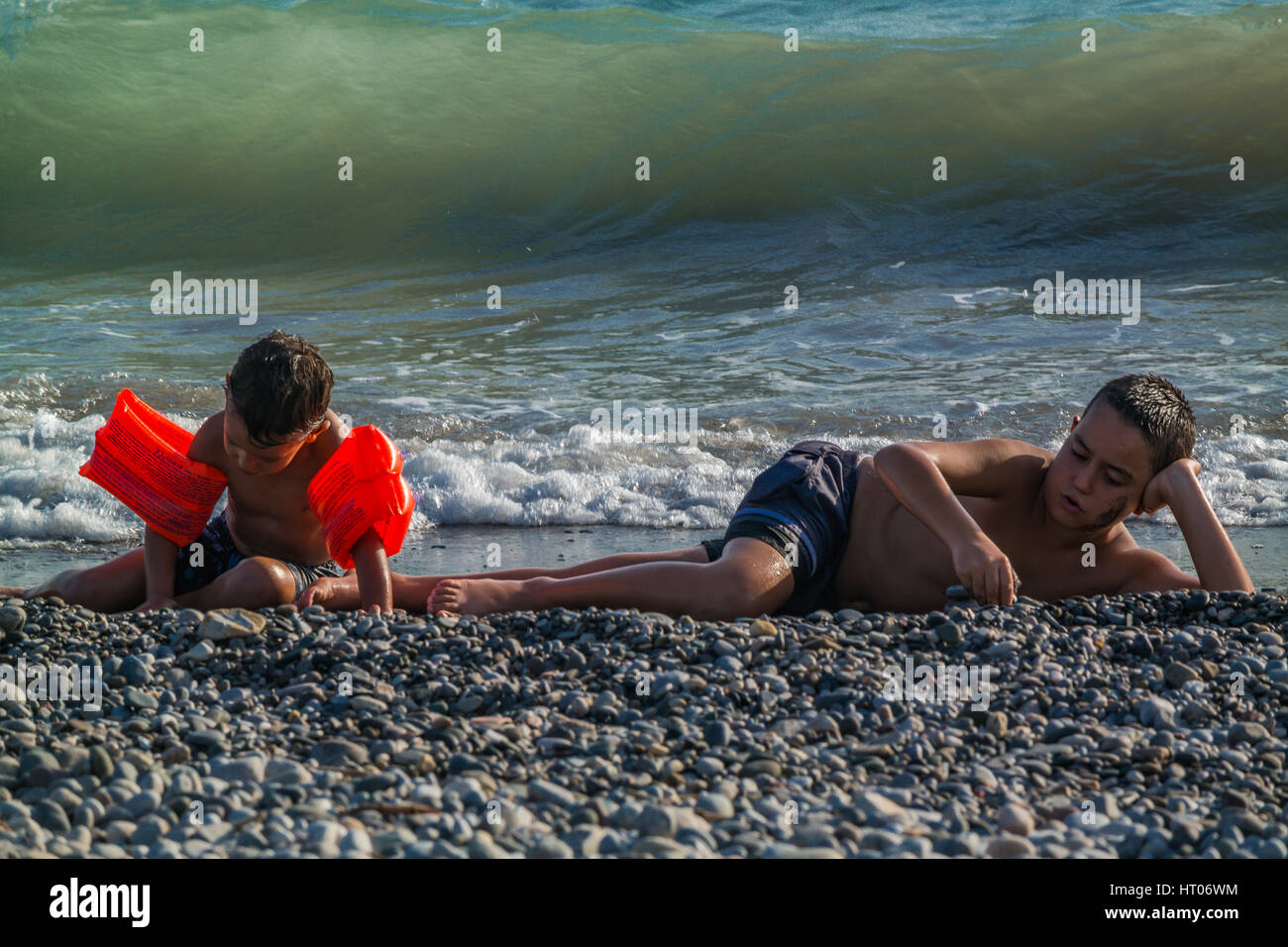 Kids playing on the beach hi-res stock photography and images - Alamy