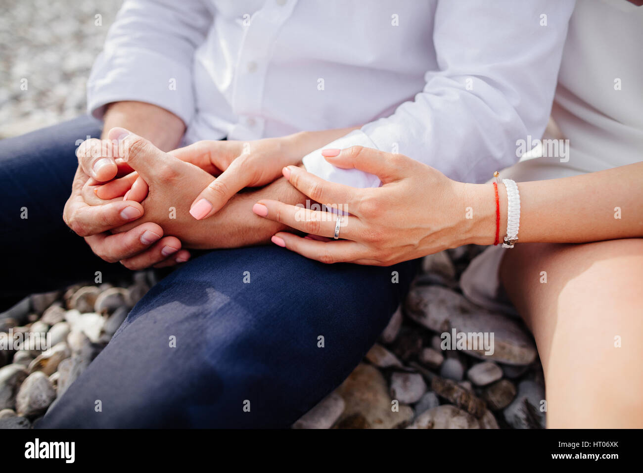 engaged couple hug together. Close up shot of hands Stock Photo - Alamy