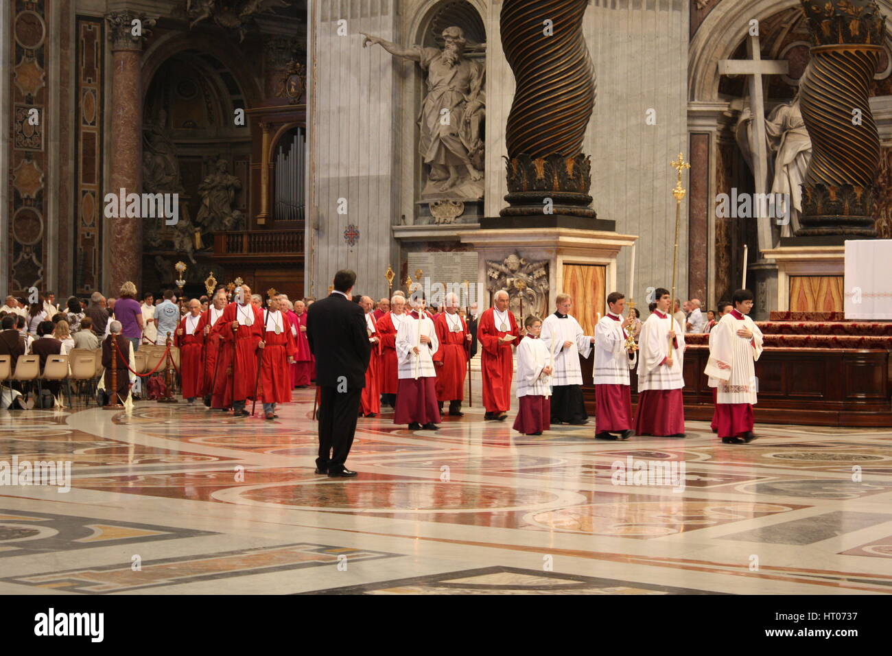 A Catholic procession inside the Basilica di San Pietro in Rome, Italy ...